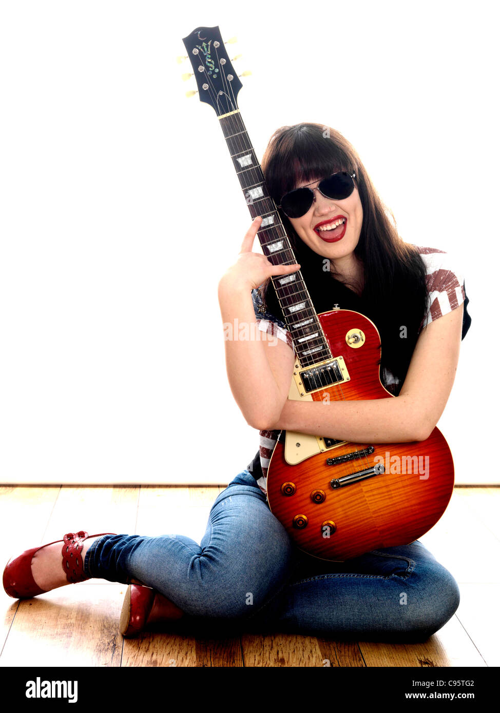 Young Woman Holding Guitar. Model Released Stock Photo - Alamy