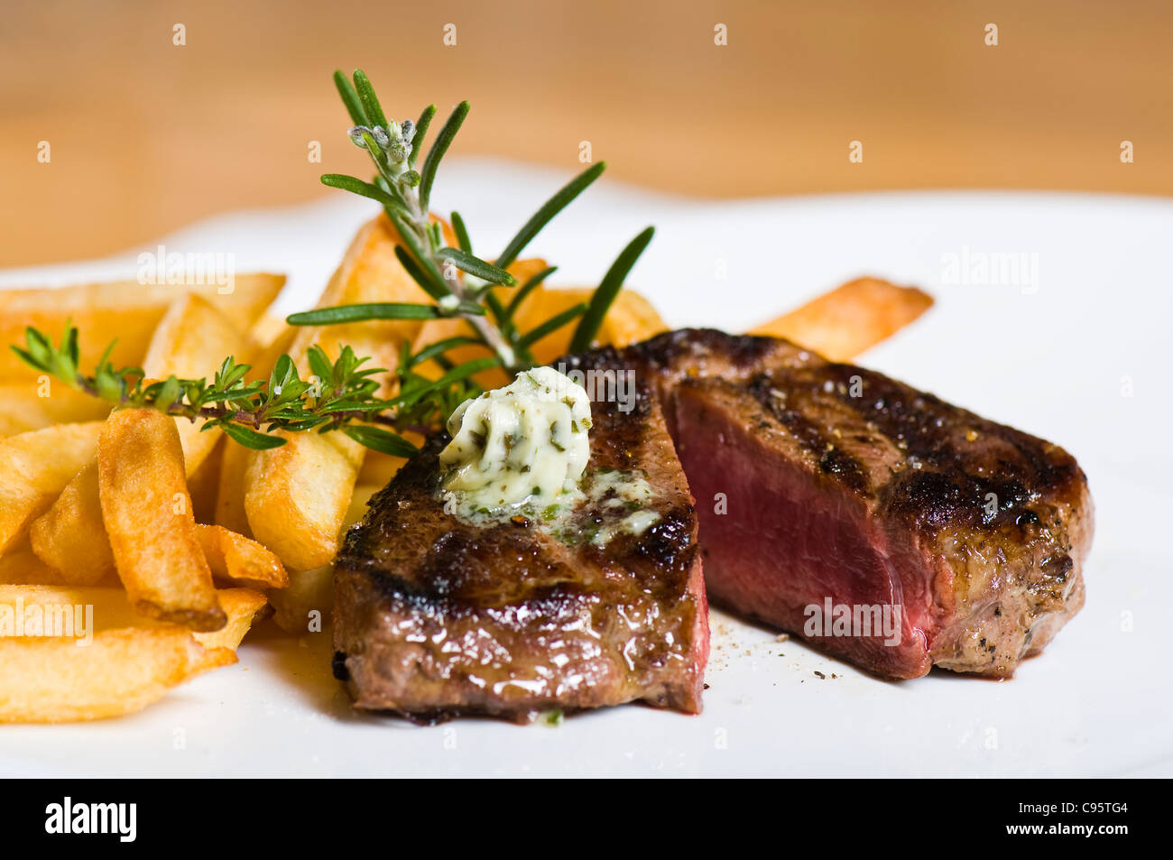 Wild boar steak with herb butter Stock Photo - Alamy