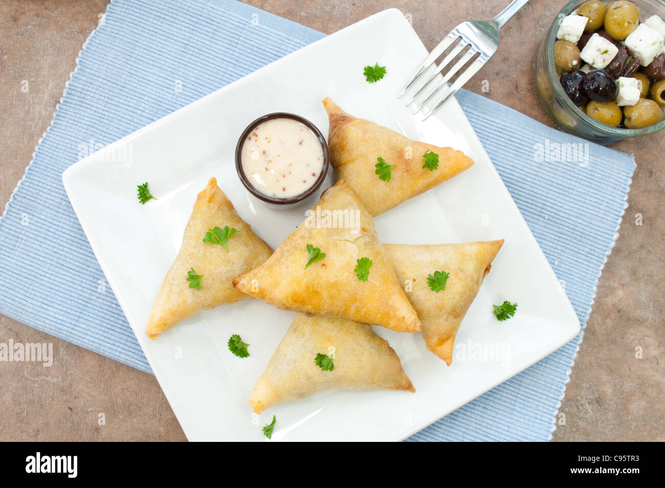 Feta cheese triangle phyllo pastries Stock Photo - Alamy