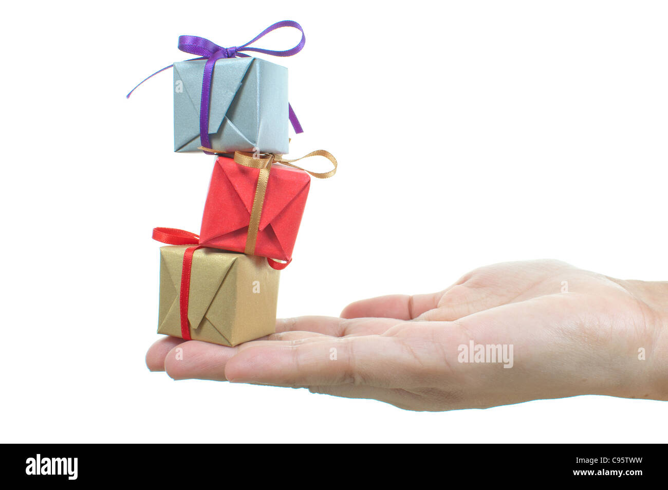 Hands presenting several small gift boxes Stock Photo - Alamy