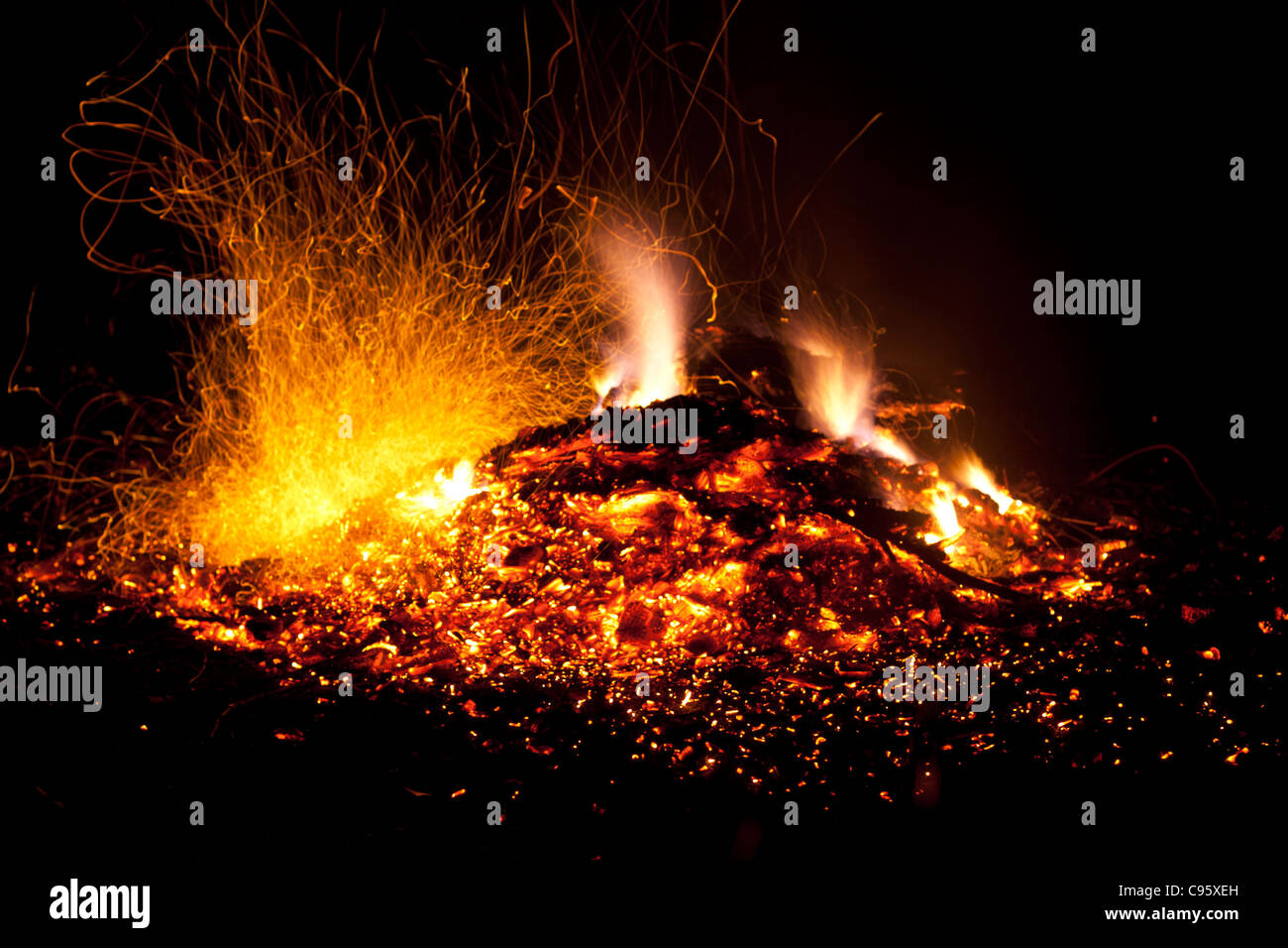 Fire with flames and sparks. Intense orange, yellow glow of bonfire ...