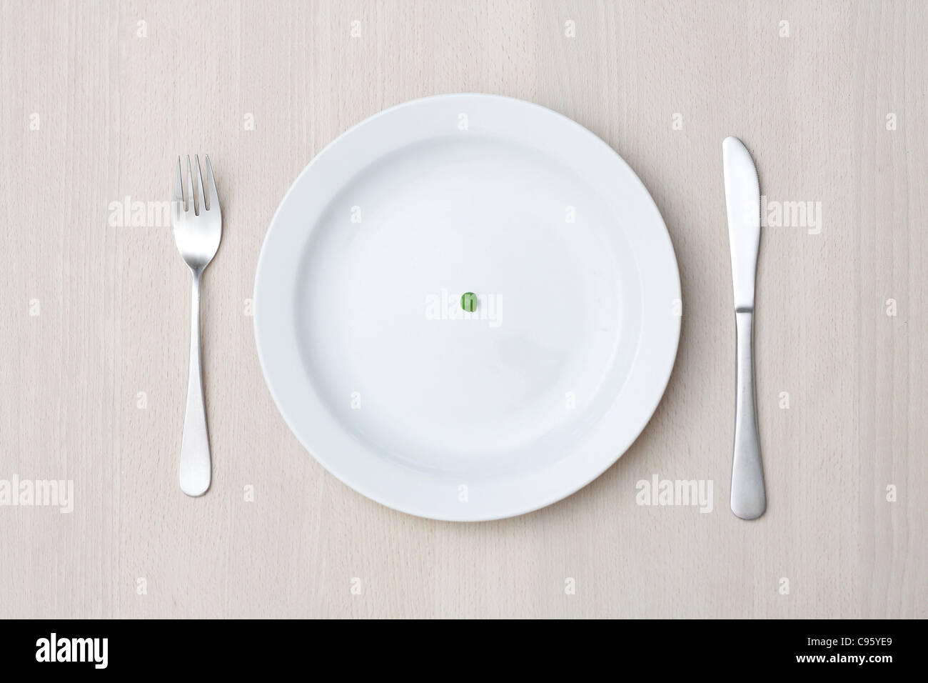 A single pea on a plate Stock Photo - Alamy