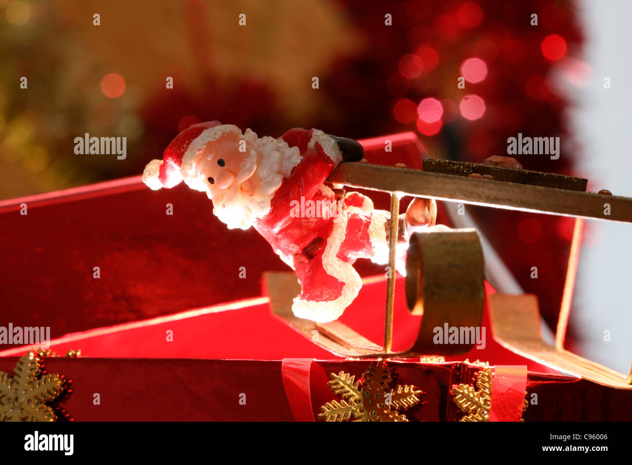 Santa claus and big red present box Stock Photo - Alamy