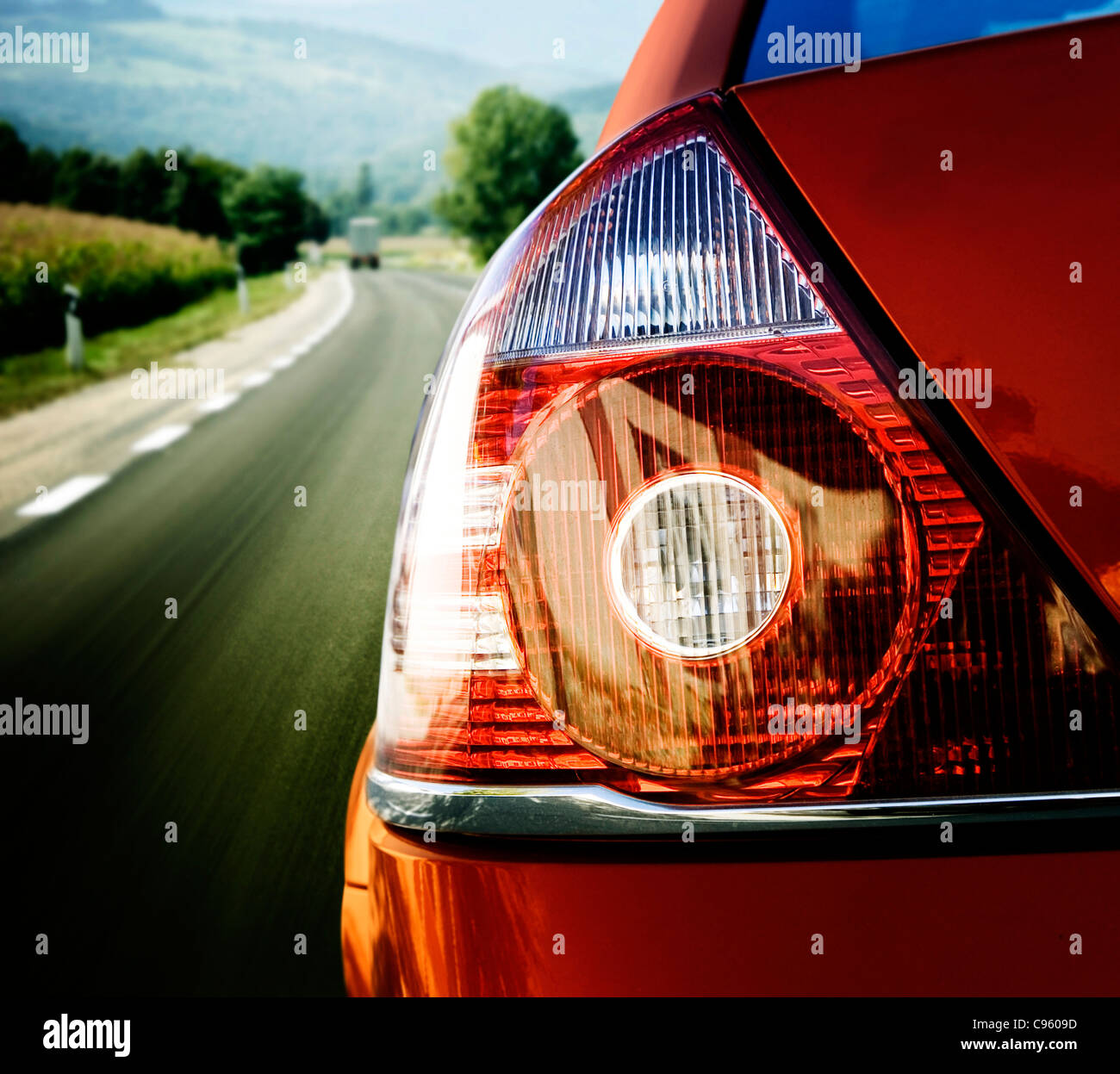 Red car on the road Stock Photo - Alamy