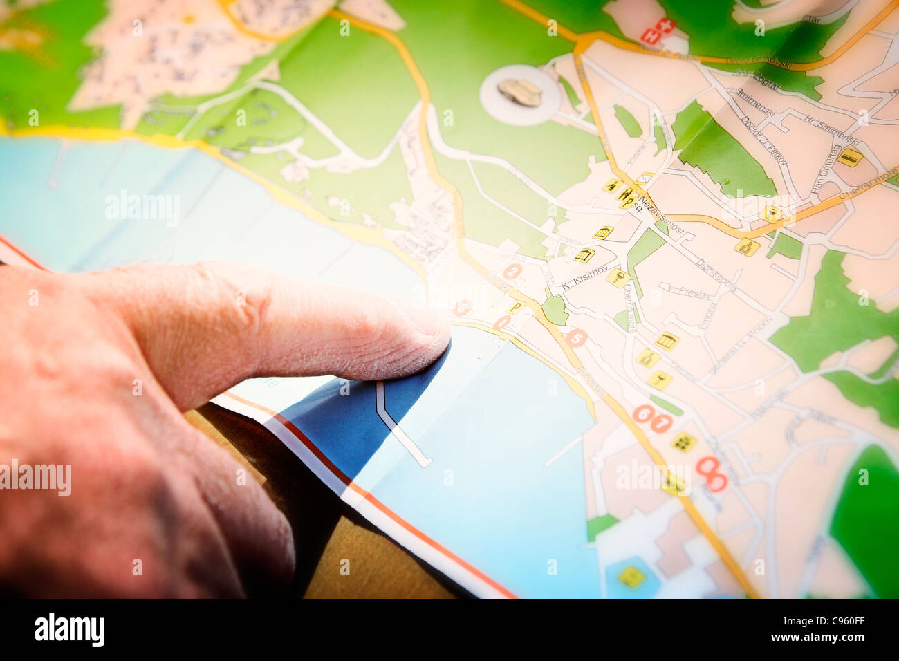 Man checking a city map Stock Photo - Alamy