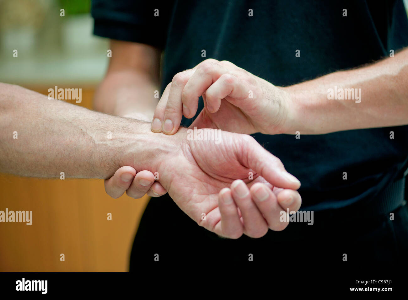 Taking a pulse Stock Photo - Alamy
