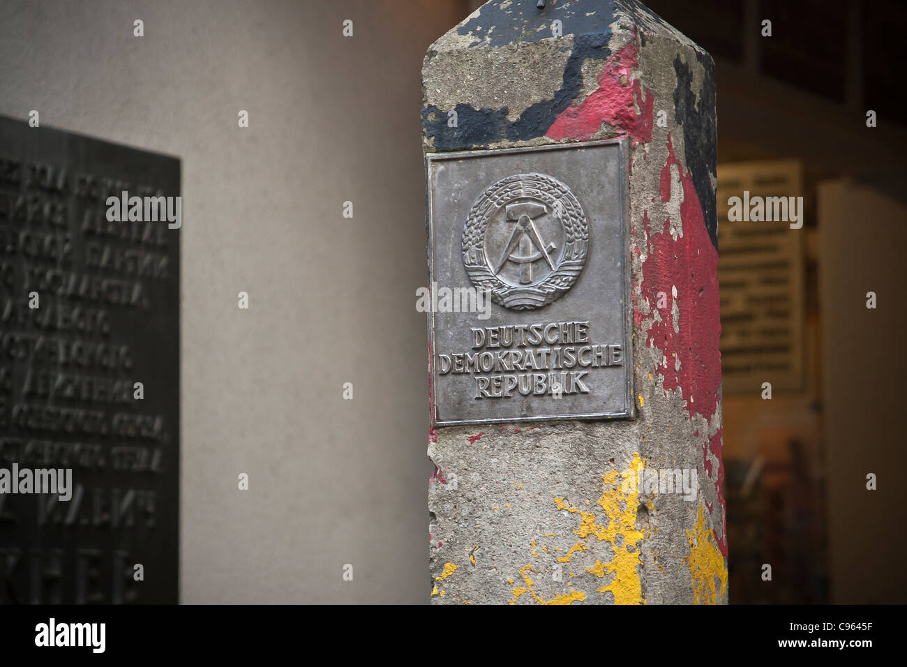 Historical DDR border pole in front of the Wall Museum at Checkpoint ...