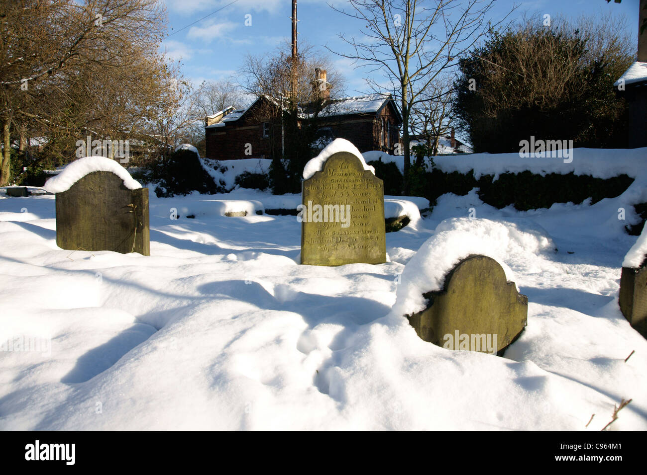 Gravestones in the snow in an abandoned graveyard, Chapel Allerton ...