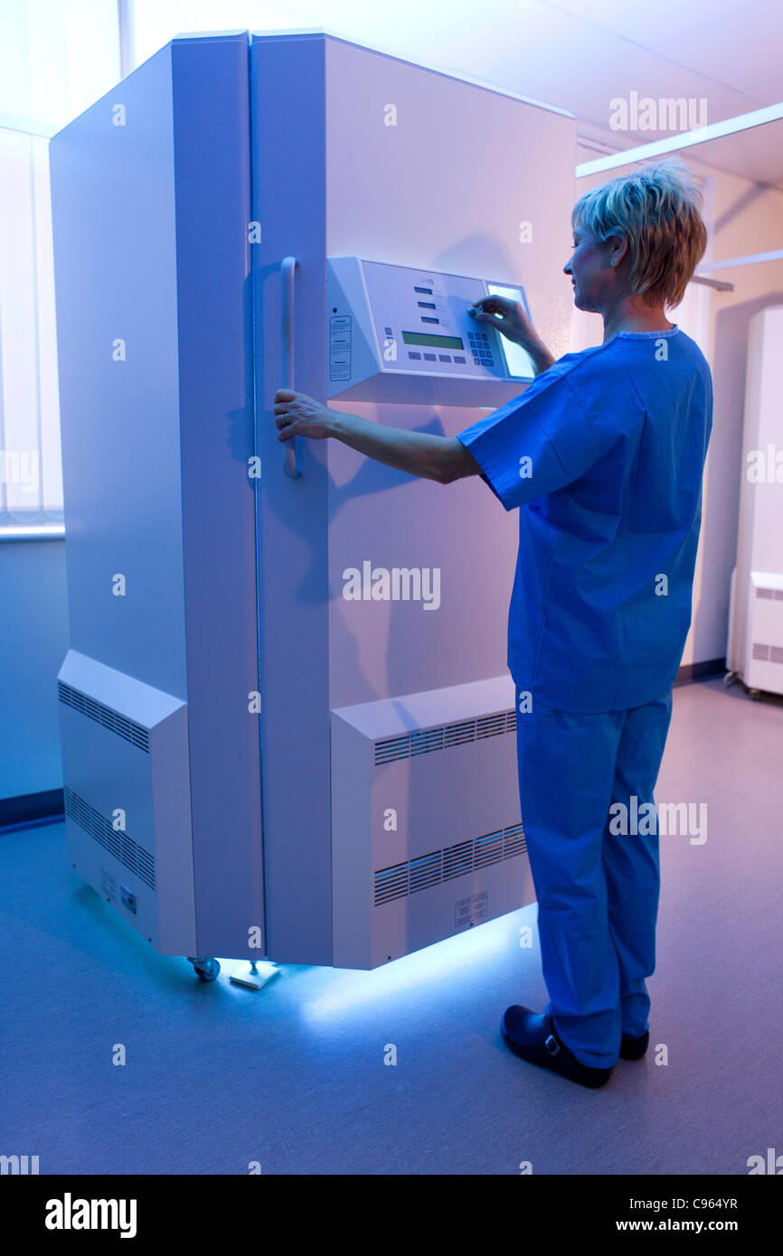 Phototherapy booth. Dermatologist setting up an ultraviolet B ...