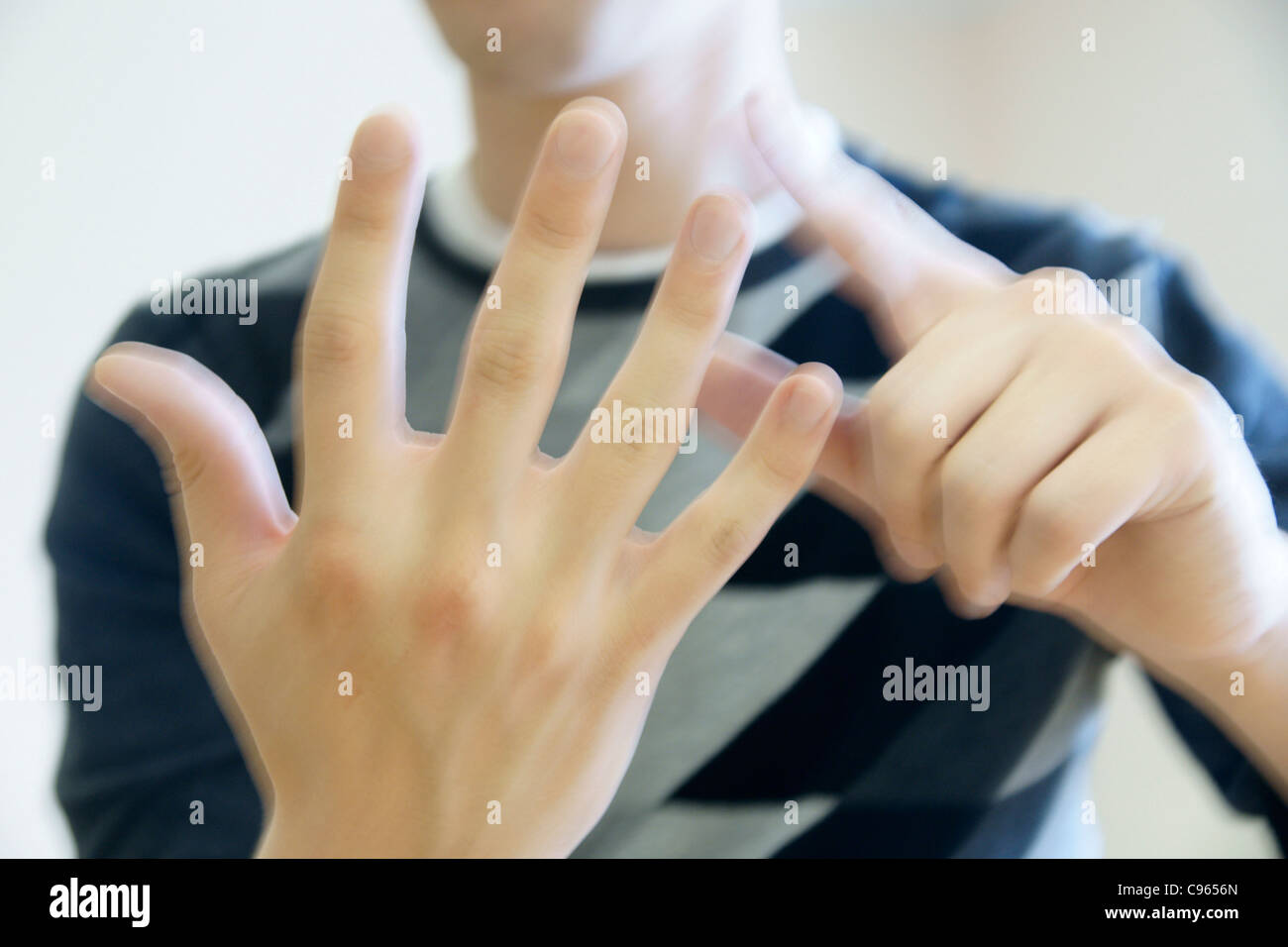 An English Teacher uses his fingers to correct a student Stock Photo ...