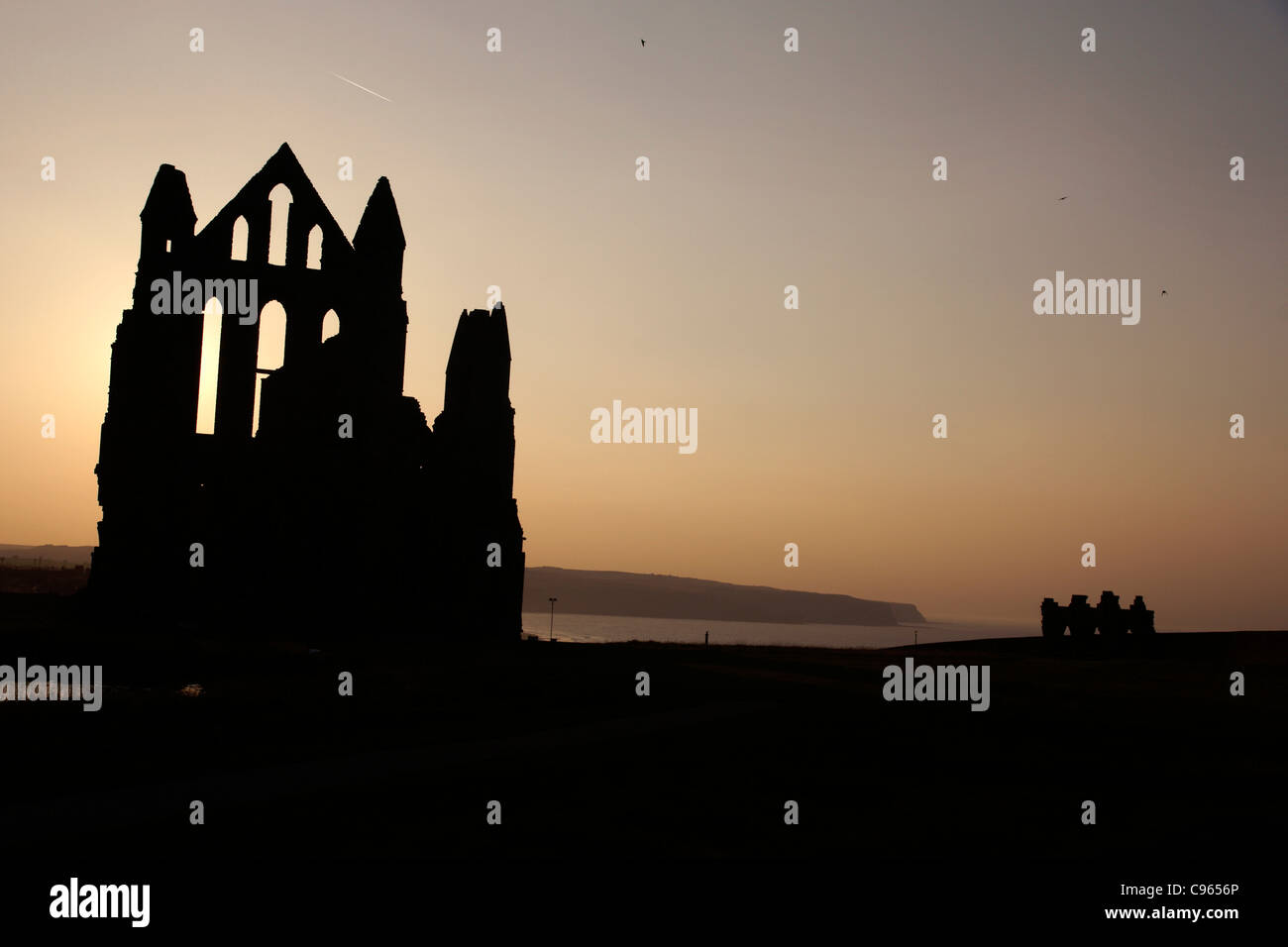 Whitby Abbey on the North Yorkshire Coast, England, UK, at sunset (c ...