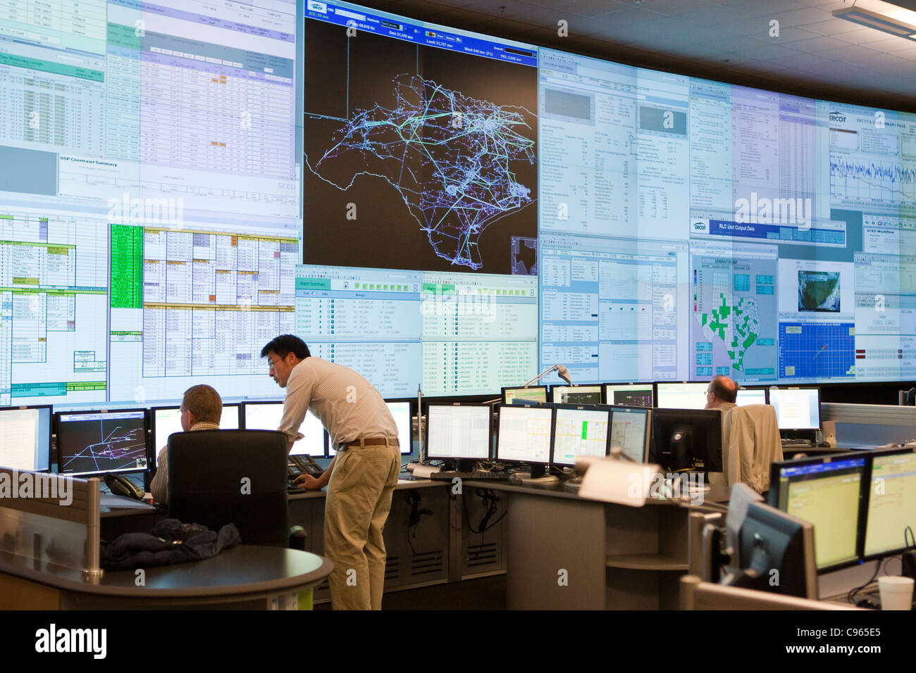Workers inside command center of the Electric Reliability Council of ...