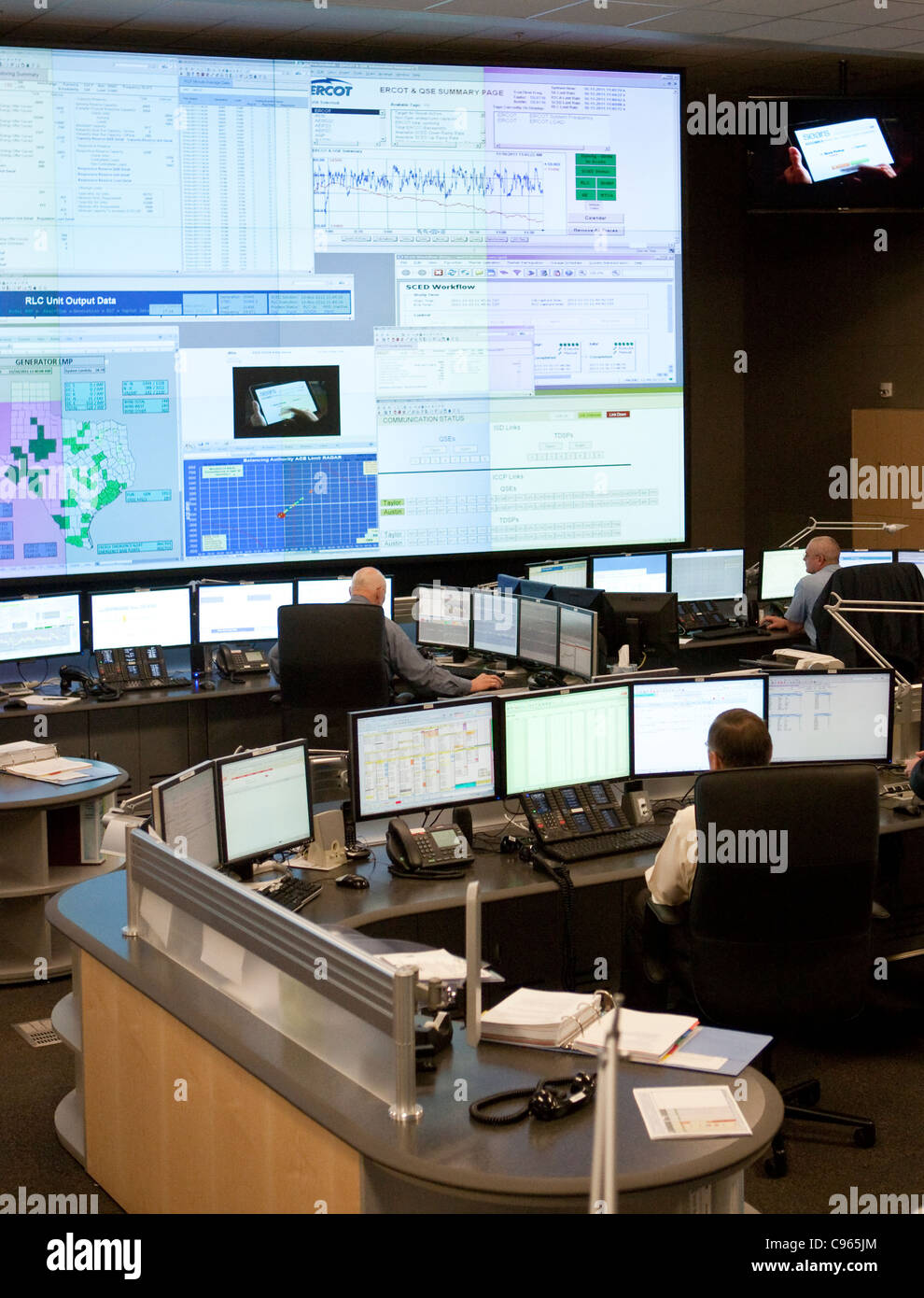 Workers inside command center of the Electric Reliability Council of ...