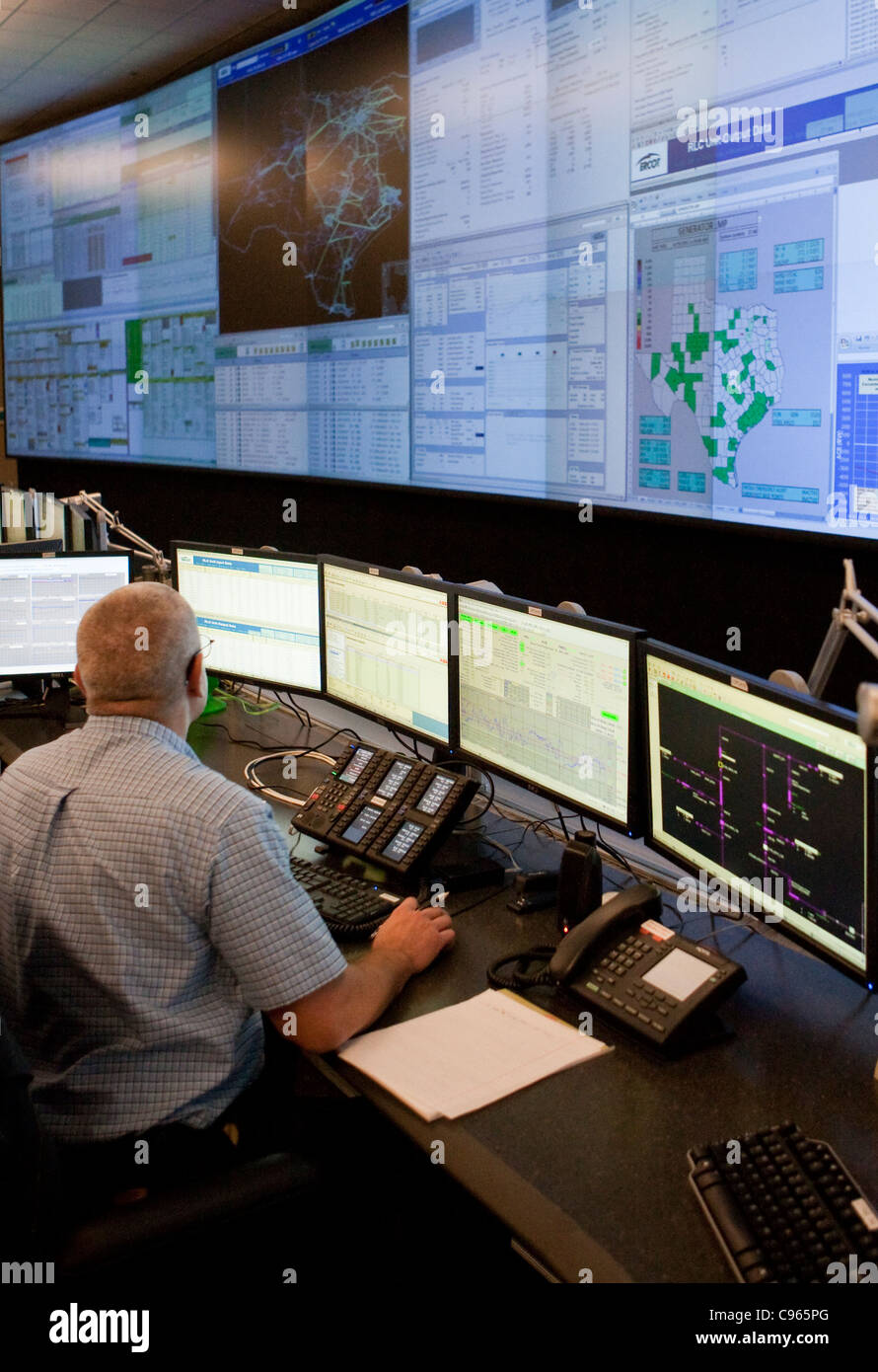 Workers inside command center of the Electric Reliability Council of ...