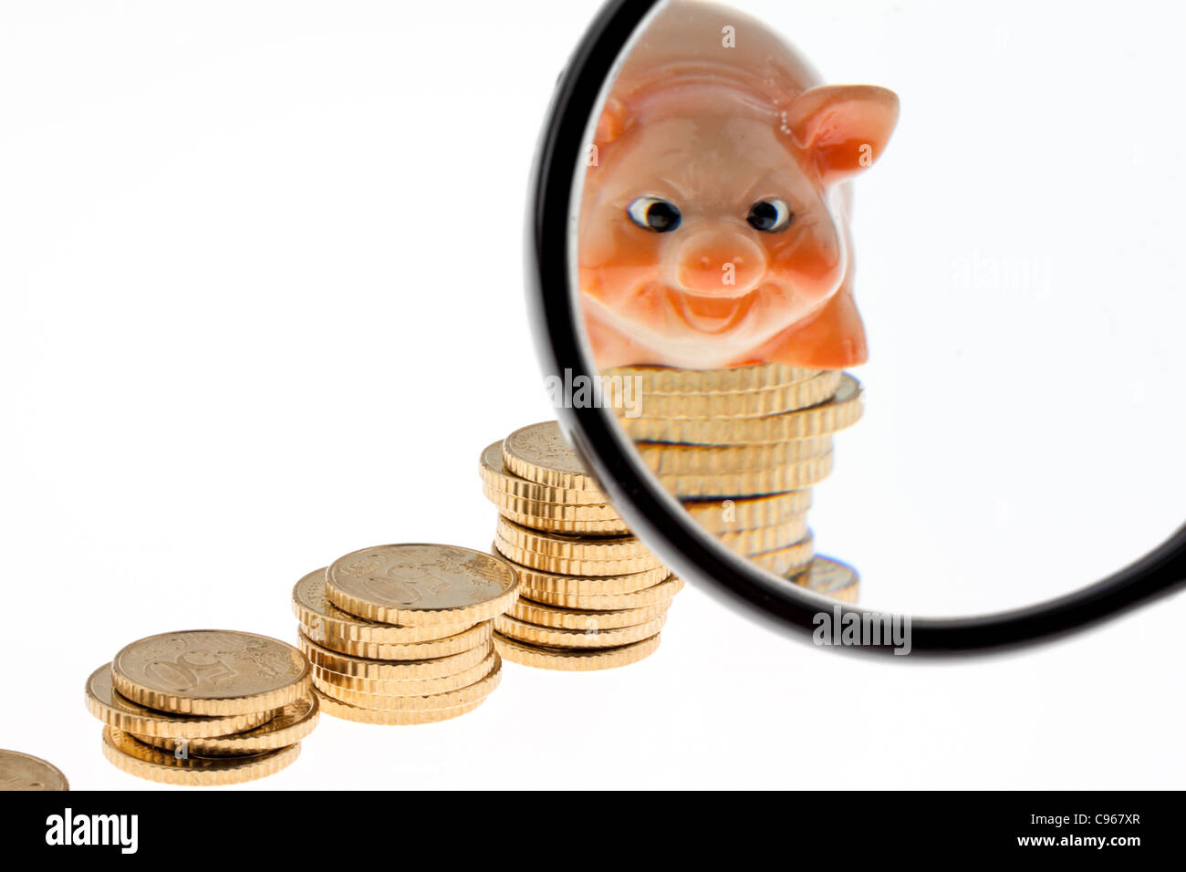 Coin Stack of euro coins with a Moneybox Stock Photo - Alamy