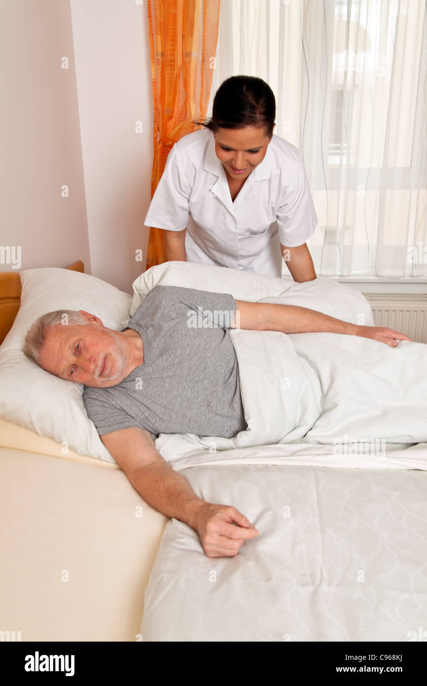 a nurse at geriatric care for the elderly in retirement home Stock ...