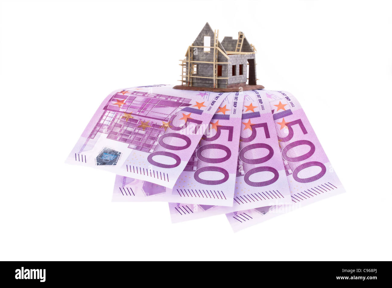 Many euro notes and shell of a house Stock Photo - Alamy