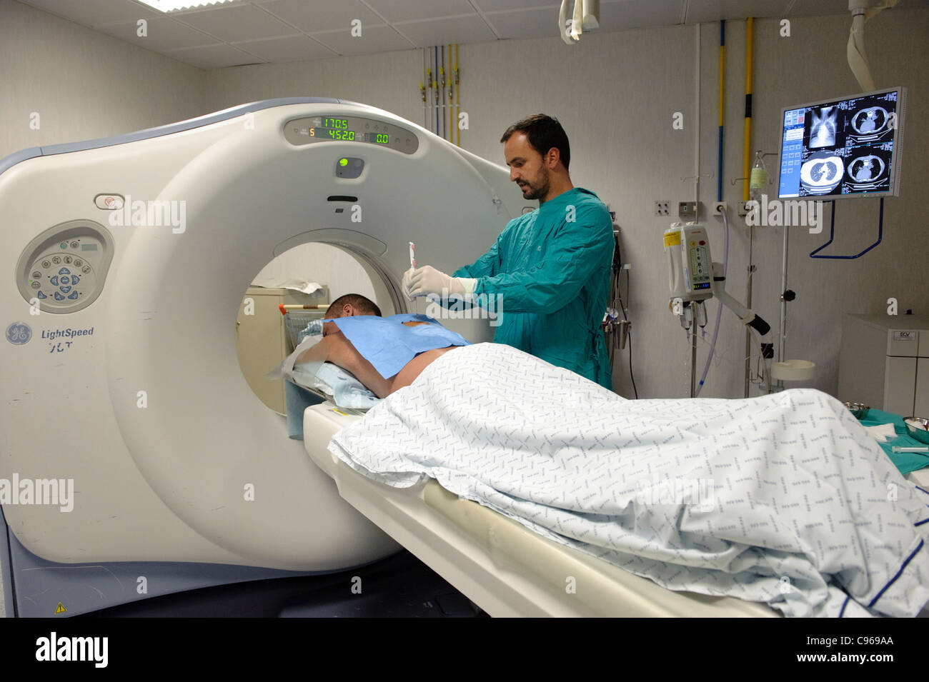 Health care professional performing fine-needle aspiration back biopsy ...