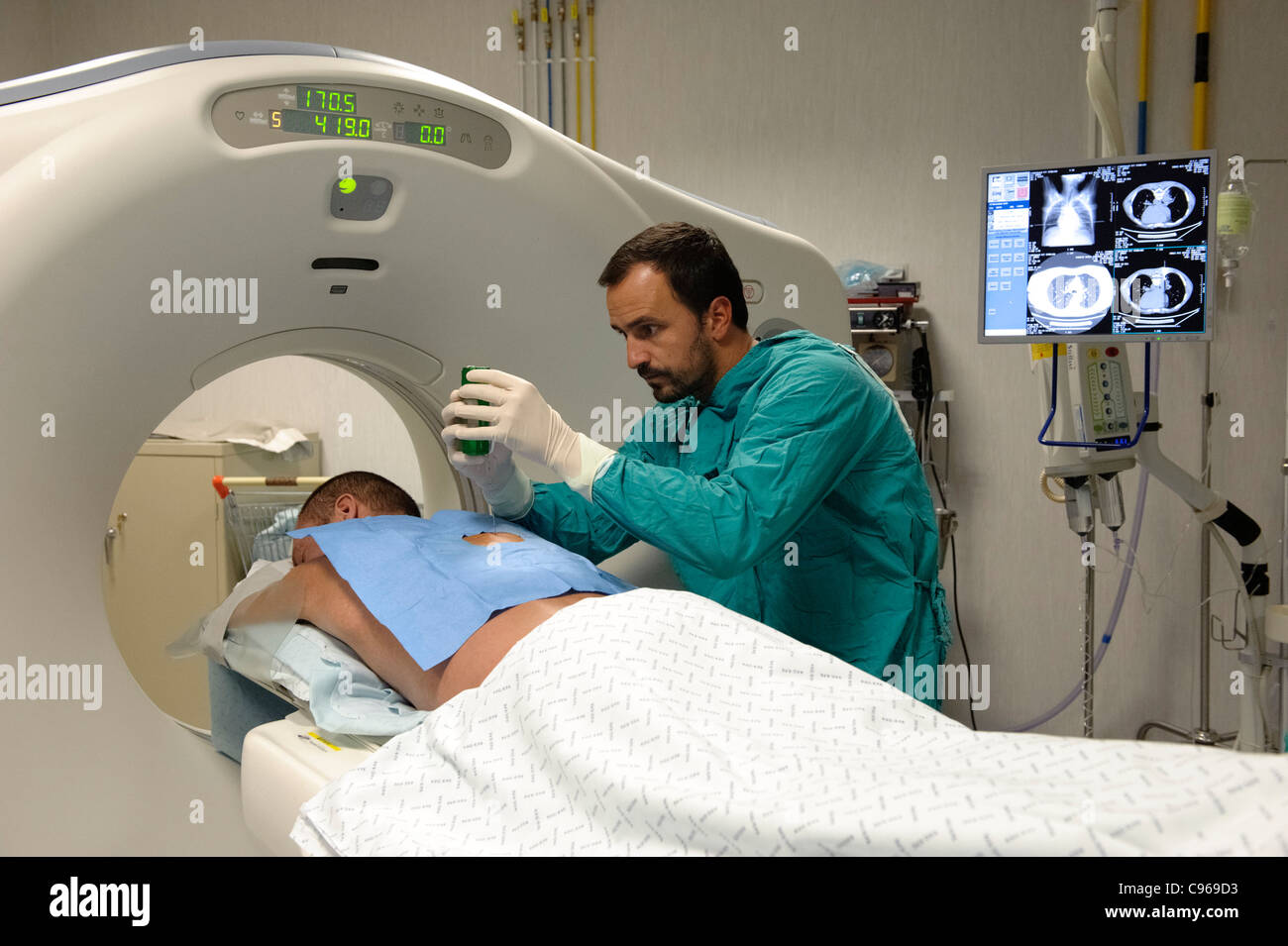 Health care professional performing fine-needle aspiration back biopsy ...