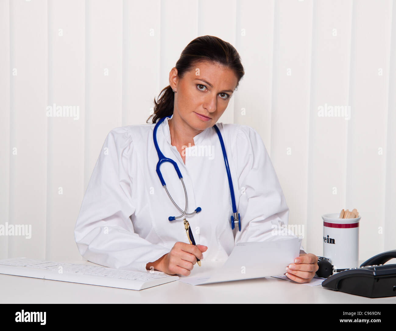 Doctor practices medicine young patient hi-res stock photography and ...