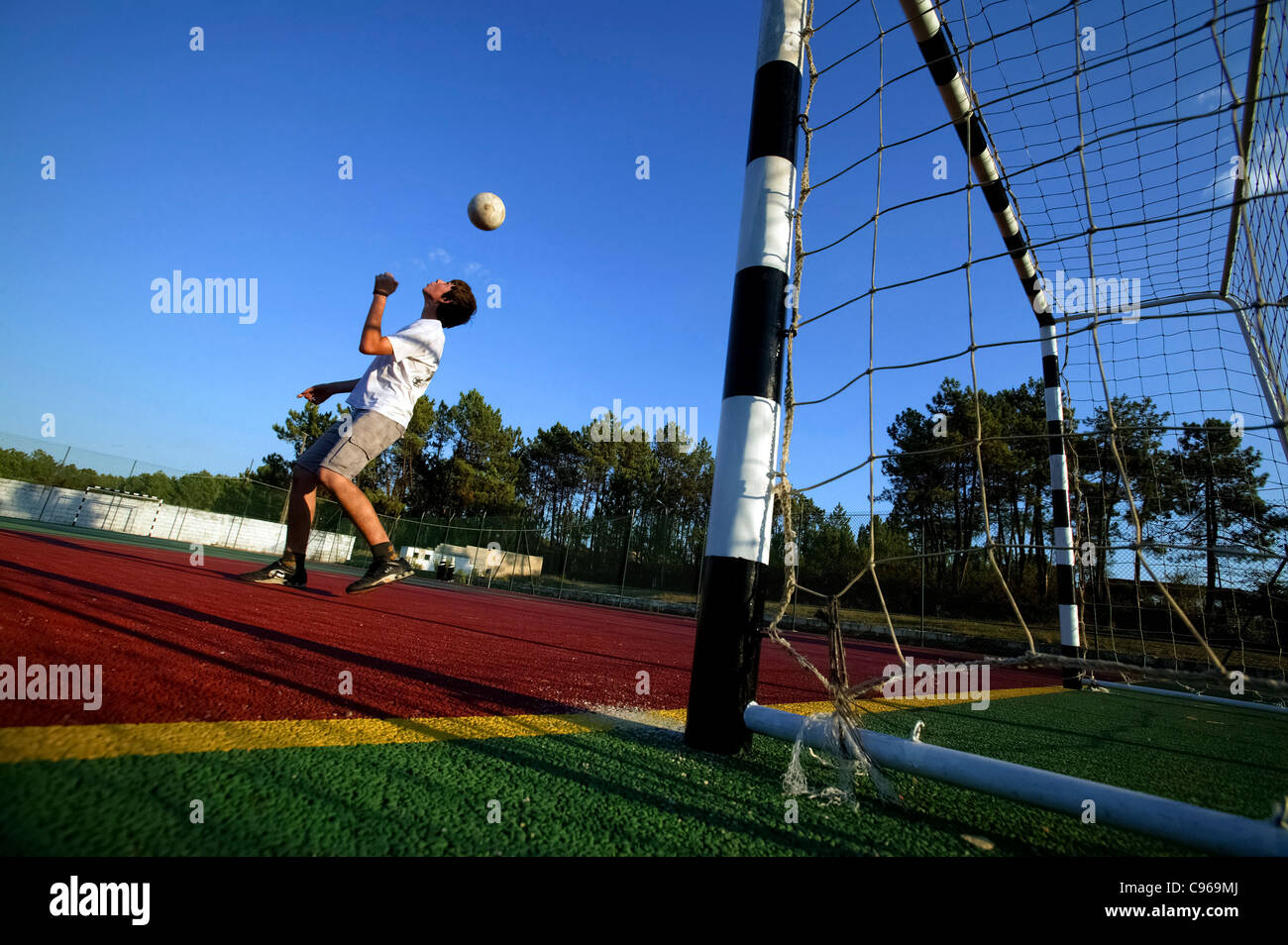 Kids playing football head hi-res stock photography and images - Alamy