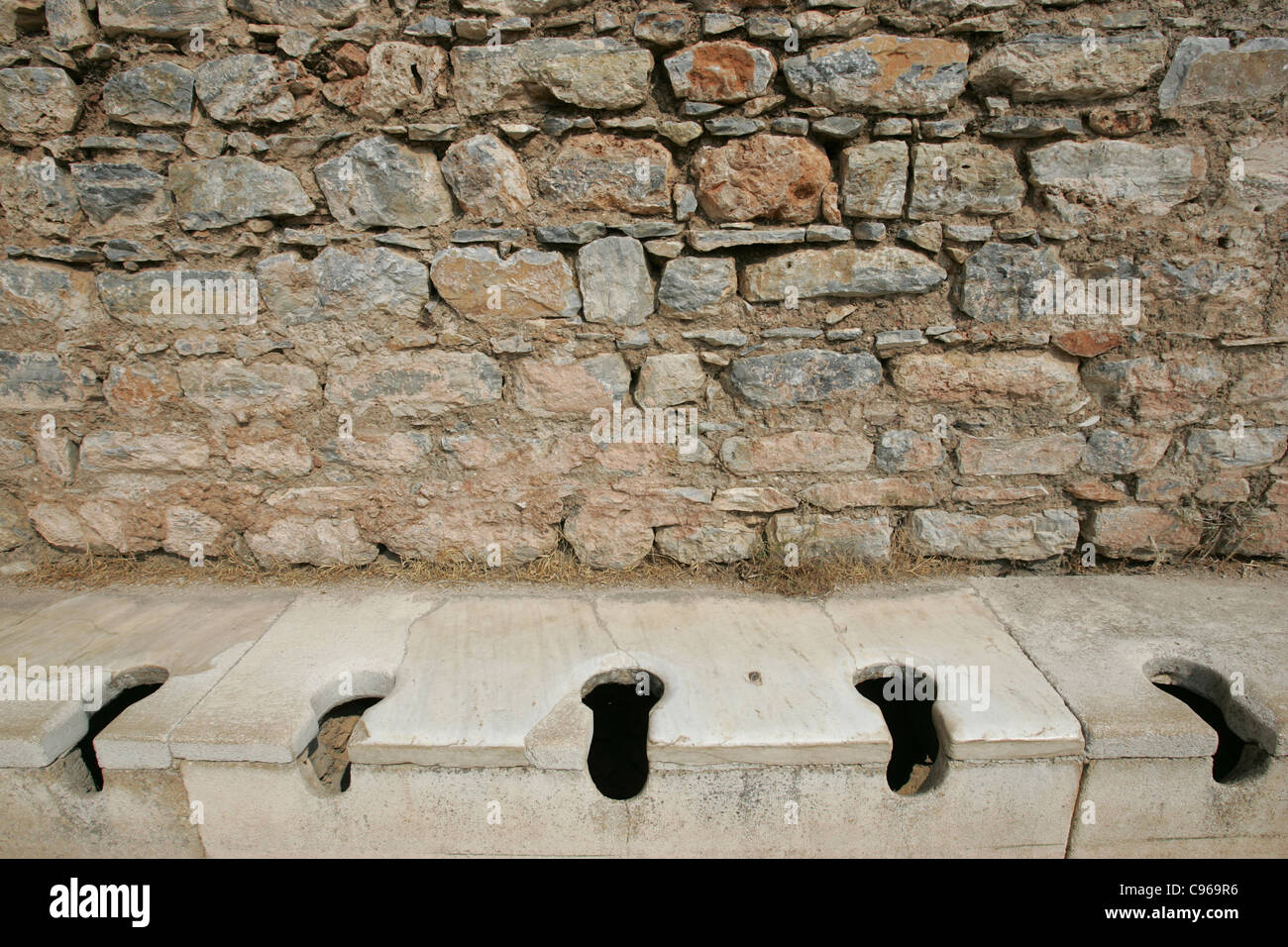 Ancient roman communal toilet at Ephesus, Turkey Stock Photo - Alamy