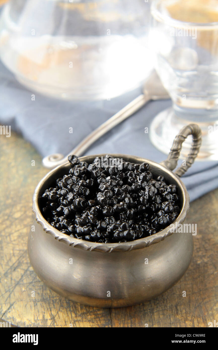 Black caviar in a glass jar on a white background Stock Photo - Alamy