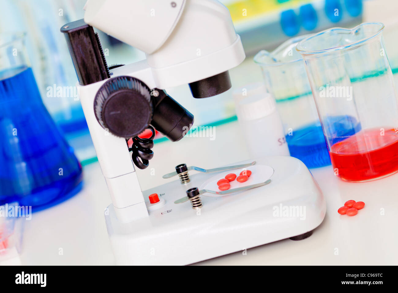 Science lab research safe of new drugs, microscope and red pills Stock ...