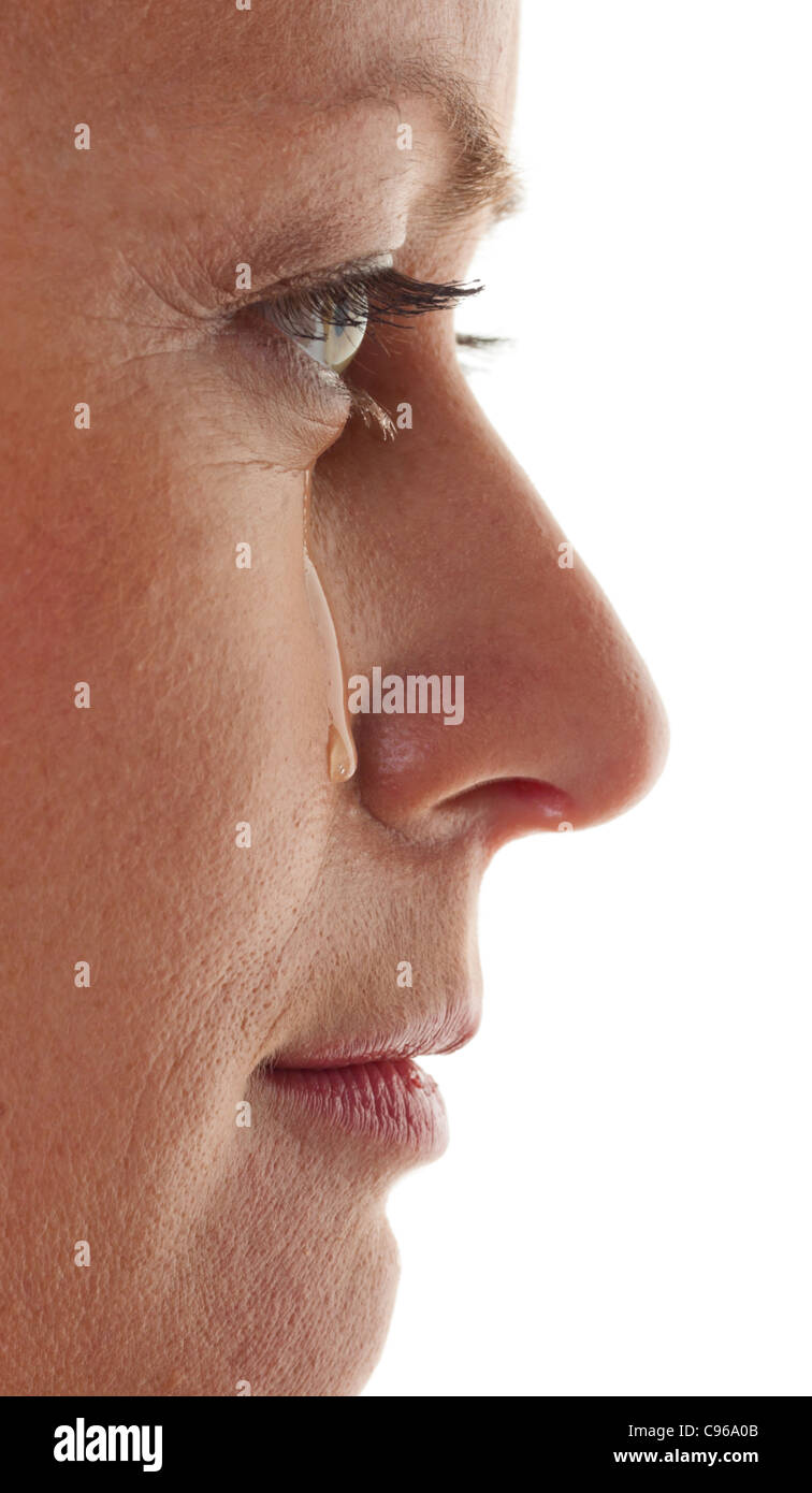 Woman is sad and cries. Teardrop on her cheek Stock Photo - Alamy