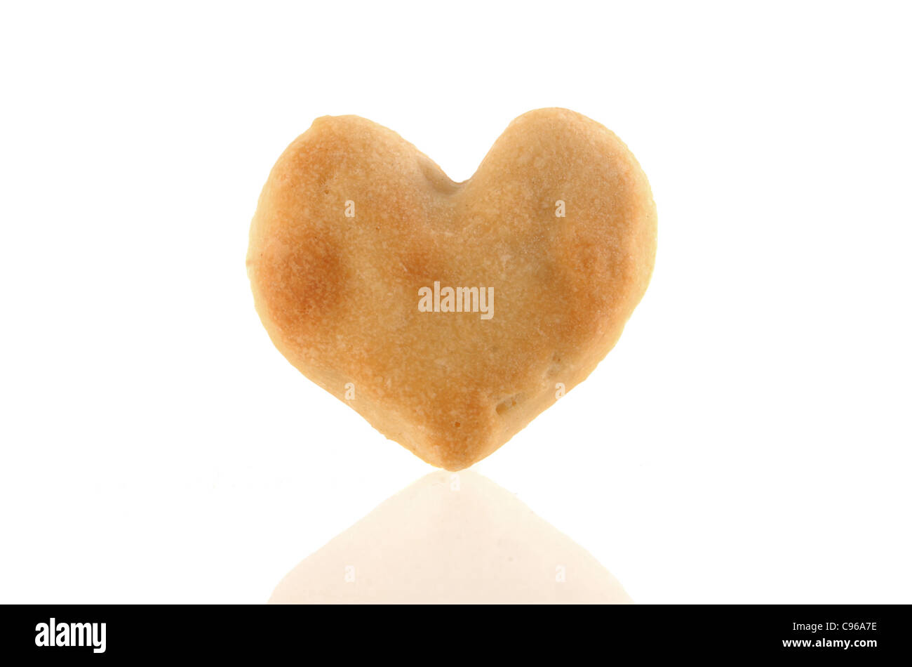 Single Heart-shaped cookie isolated with reflection on white background ...
