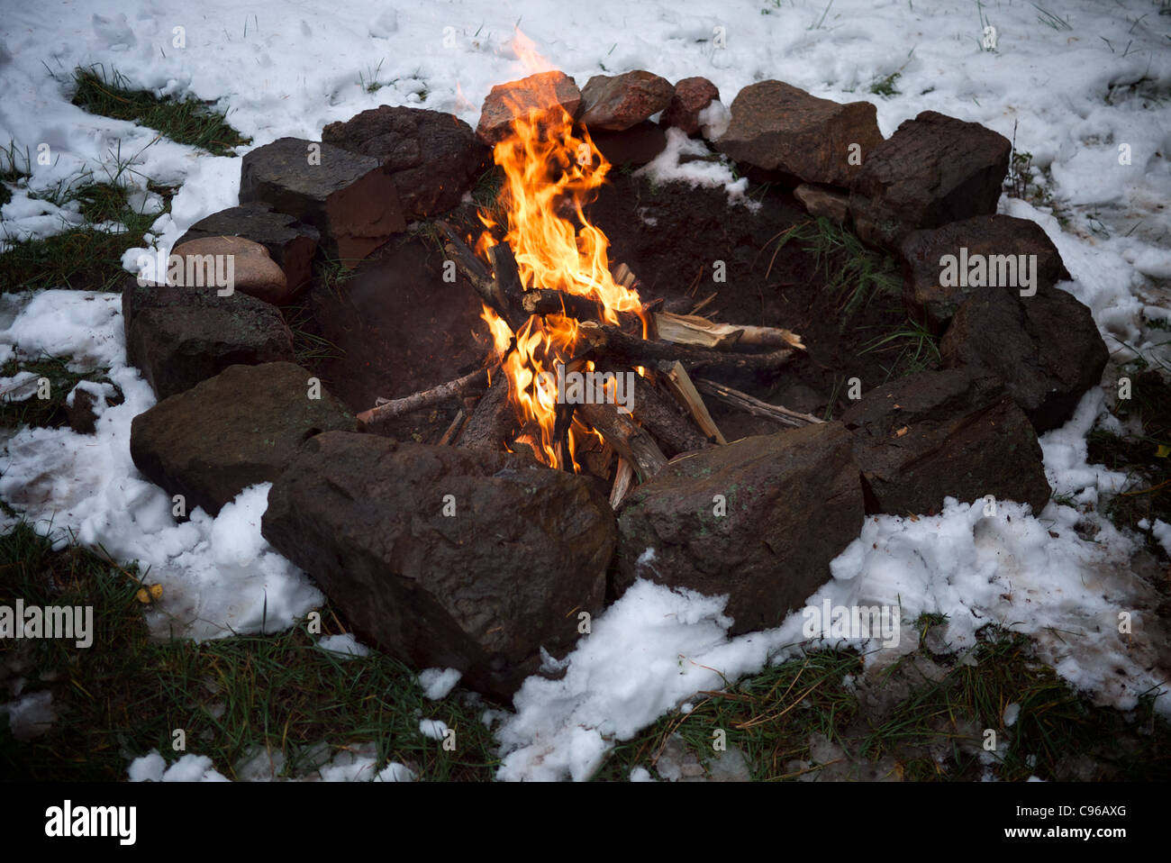 Fire pit in snow Stock Photo - Alamy