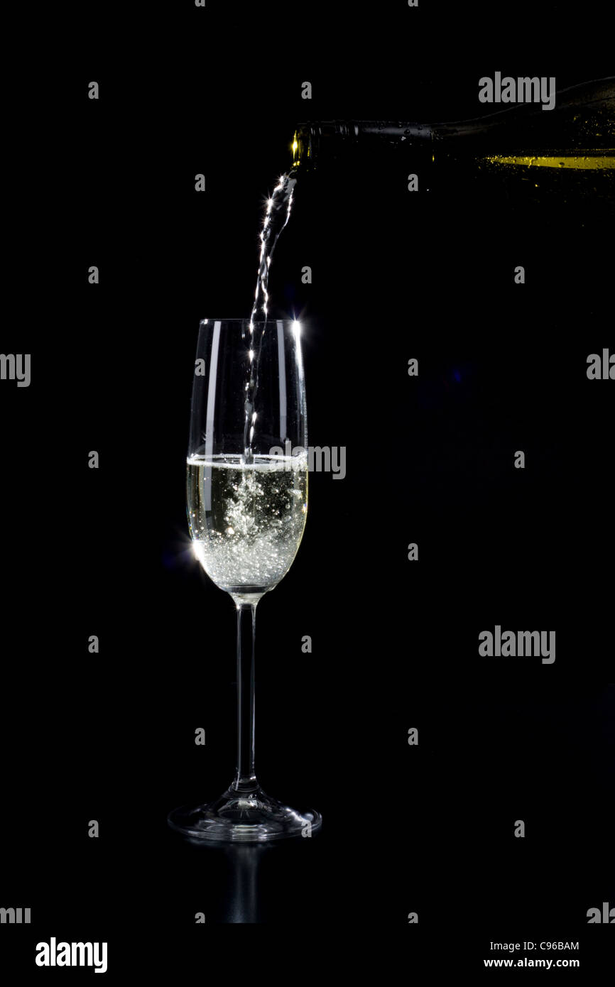 Prosecco is poured into a glass Stock Photo - Alamy