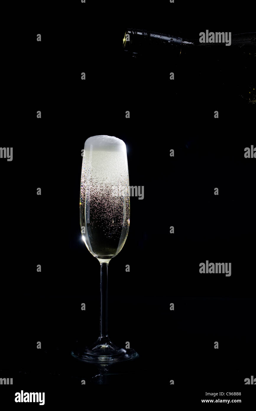 Prosecco is poured into a glass Stock Photo - Alamy