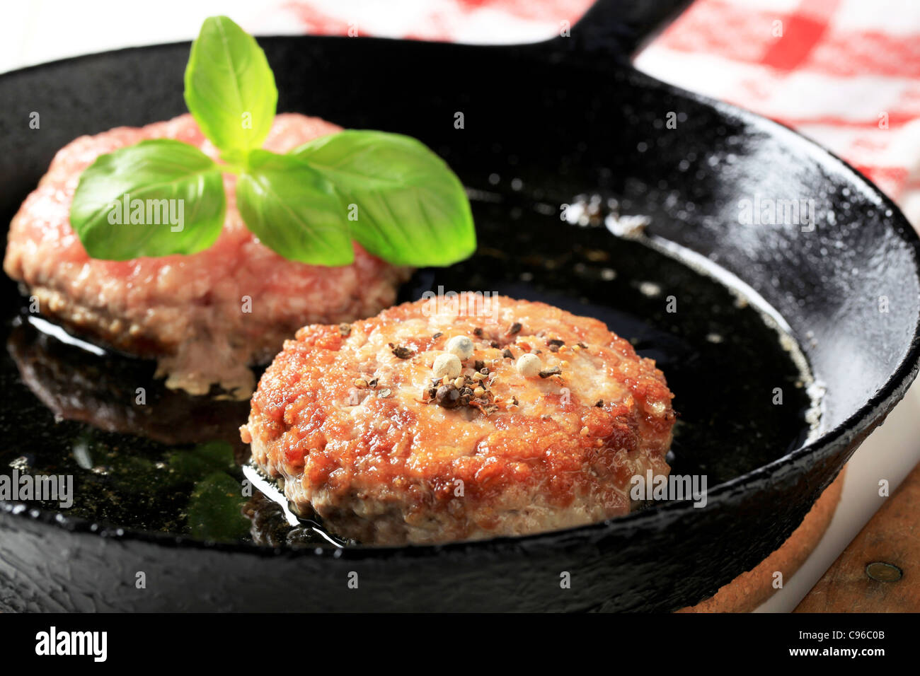 Detail of pan fried patties on a fry pan Stock Photo - Alamy