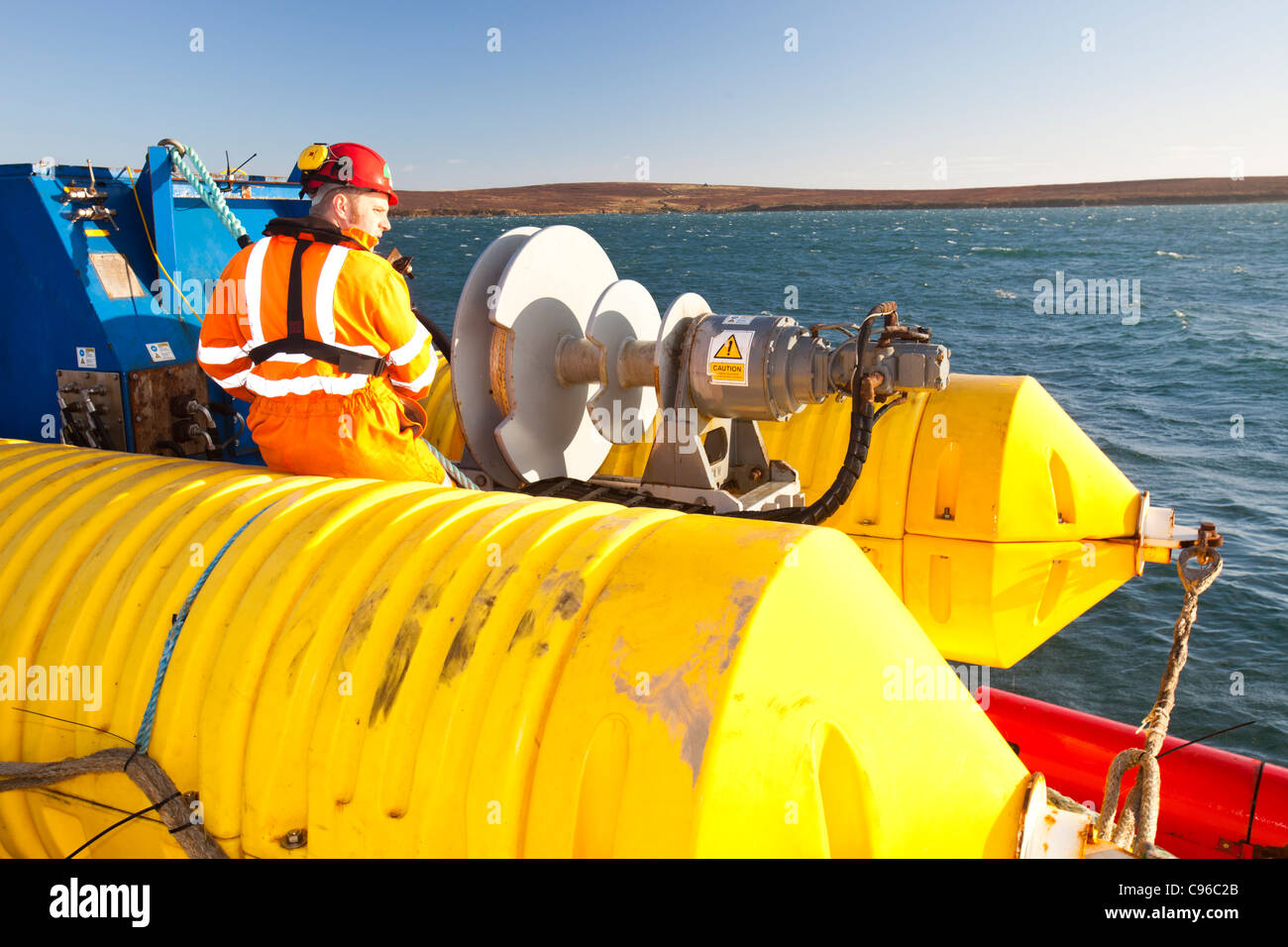 A Pelamis P2 wave energy generator on the dockside at Lyness on Hoy ...