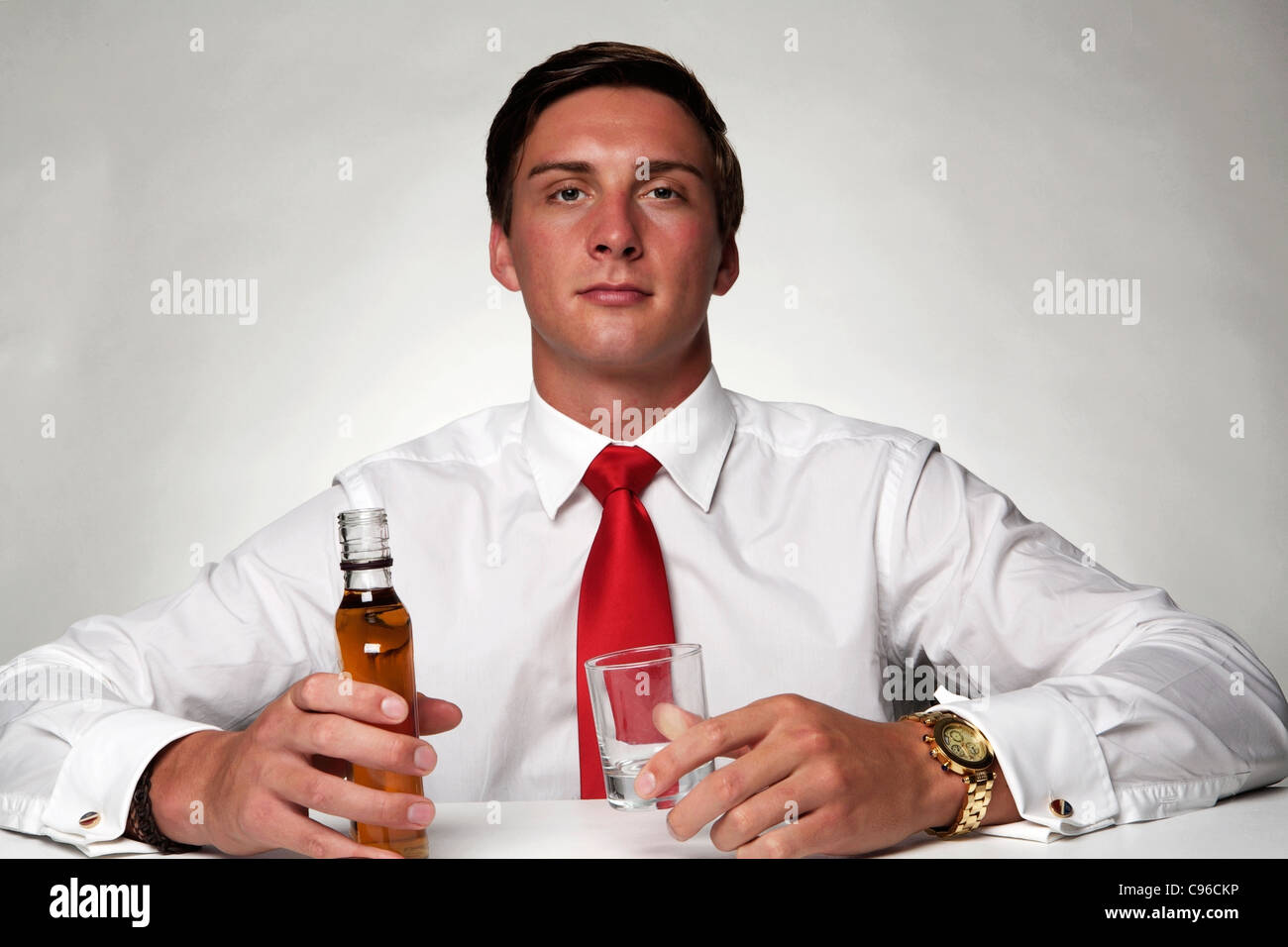 businessman having a drink at work Stock Photo - Alamy