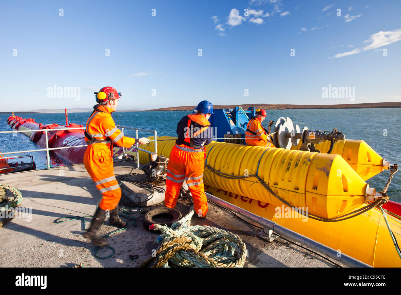 A Pelamis P2 wave energy generator on the dockside at Lyness on Hoy ...