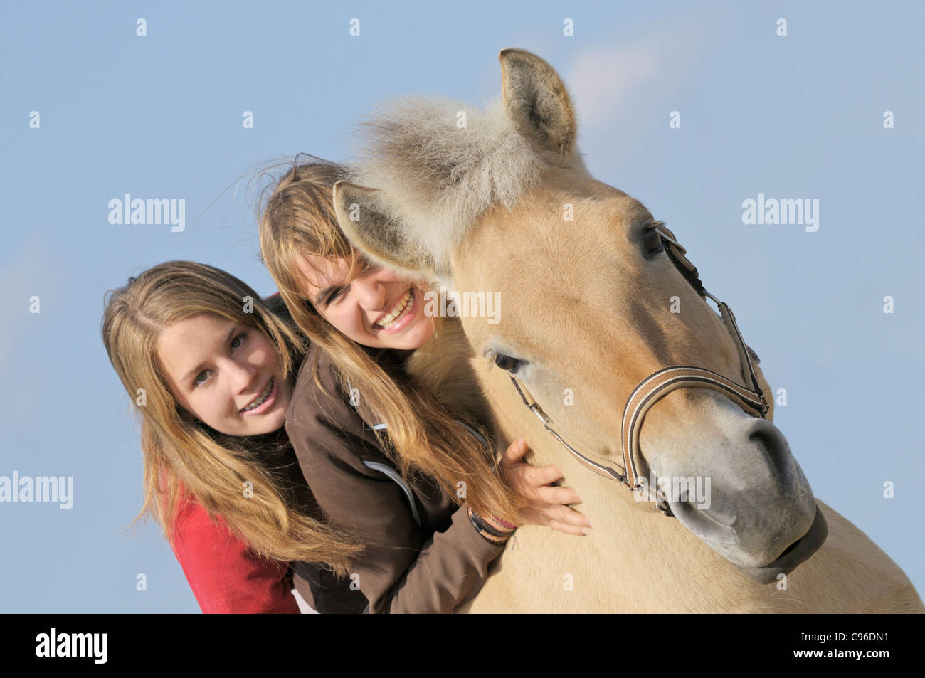 Two girls on ponies riding hi-res stock photography and images - Alamy