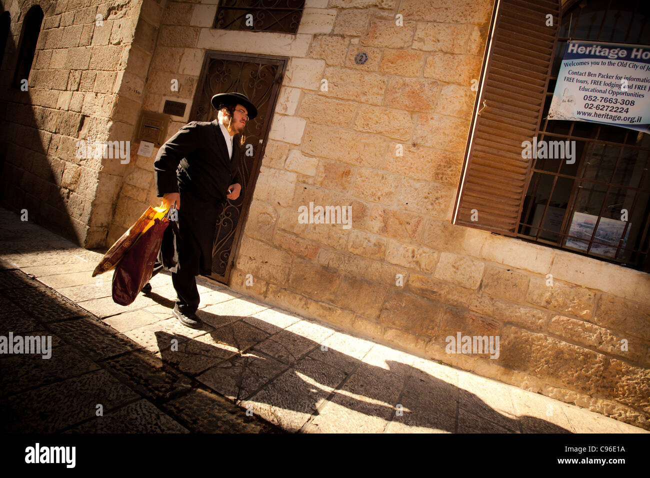 Orthodox Jewish man walking through Jerusalem jewish Quarter Stock ...