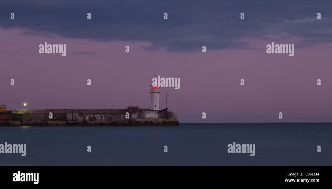 Lighthouse at sunset Stock Photo - Alamy