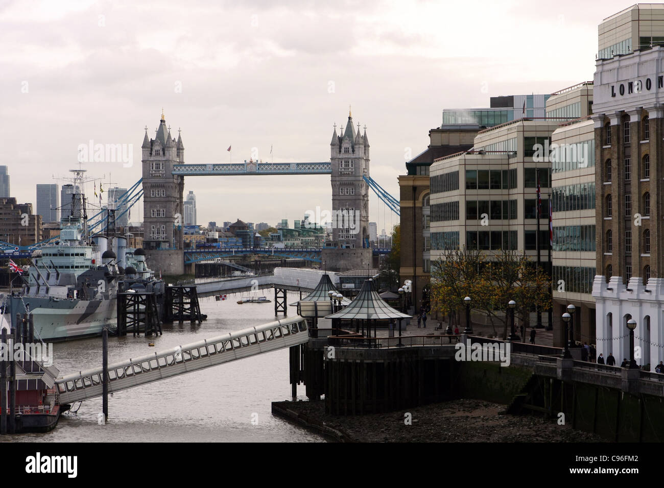 a view from London Bridge towards Tower Bridge in london on a dull day ...