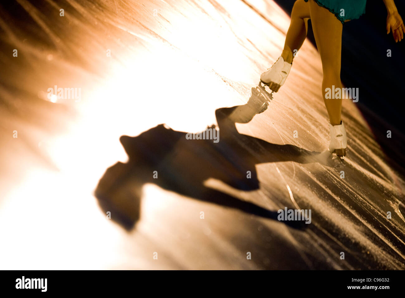 Shadow of female figure skater in action Stock Photo - Alamy