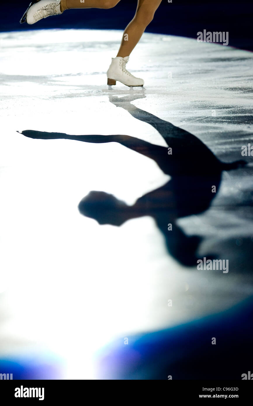 Shadow of female figure skater in action Stock Photo - Alamy