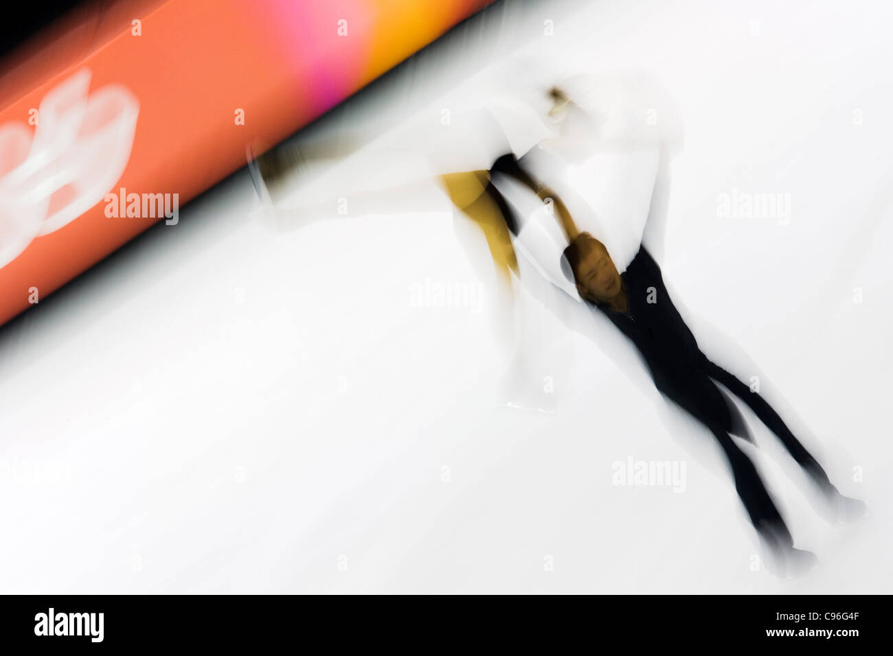 Blurred action of pairs figure skaters Stock Photo - Alamy