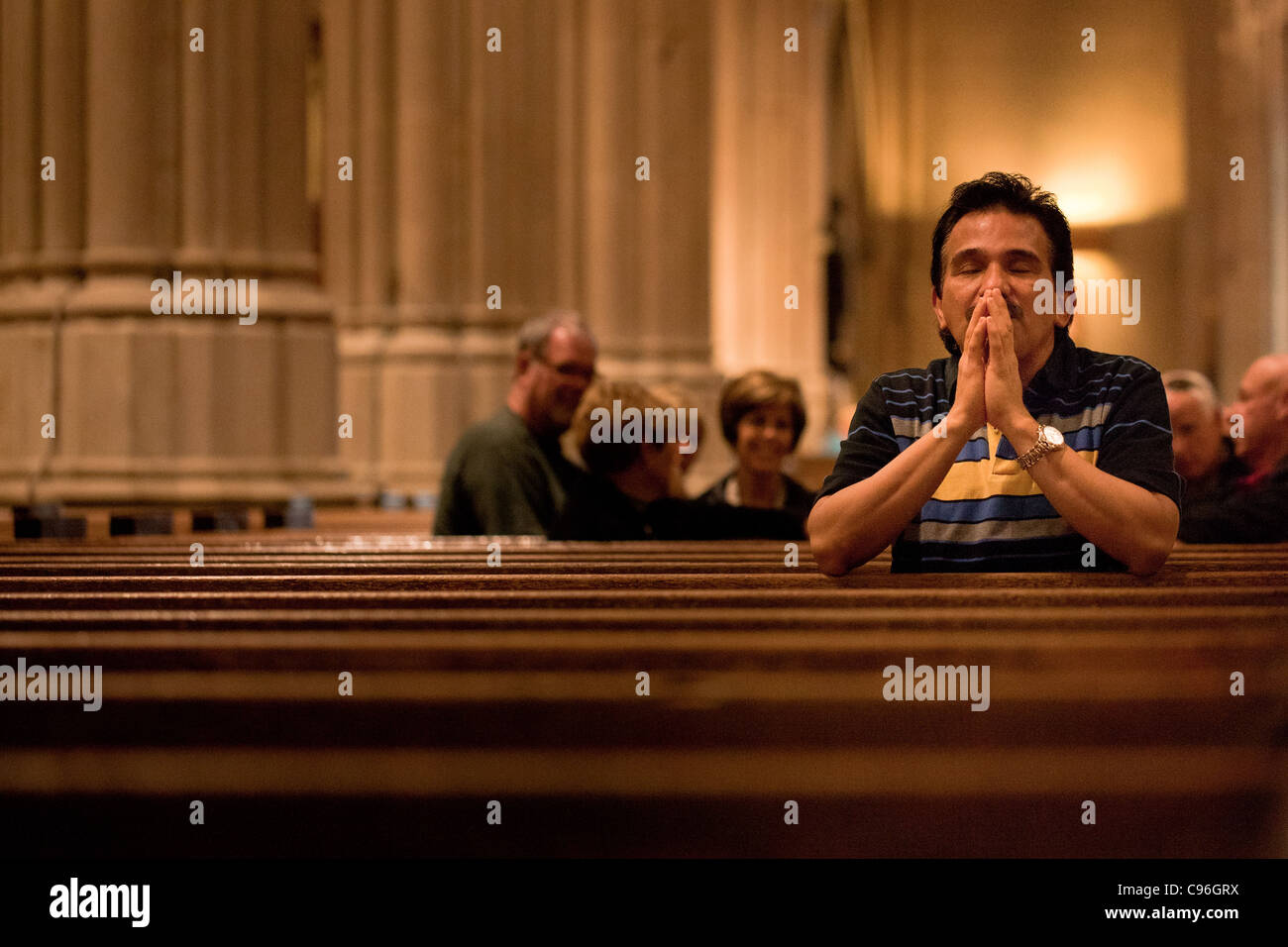 Man praying in church hi-res stock photography and images - Alamy