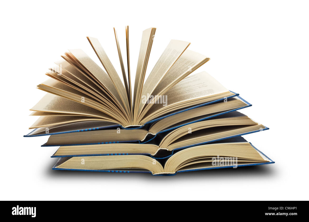 Pile of books with one book open on white background Stock Photo - Alamy