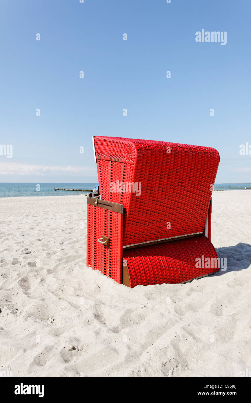Red beach chair in the dunes and blue sky, Baltic Sea, Germany, Europe ...