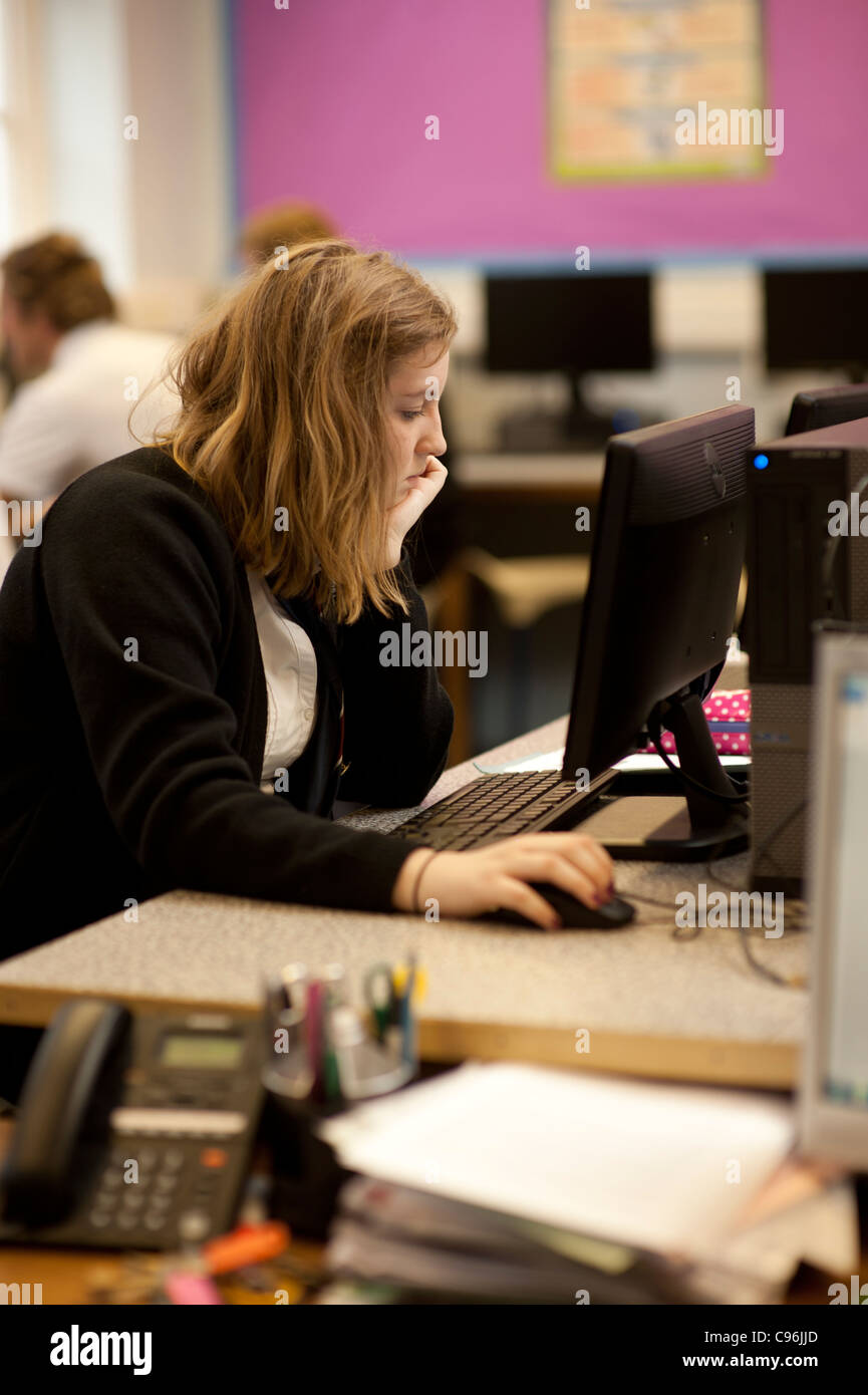 A Secondary school children, teenage girl, in a computer science class ...
