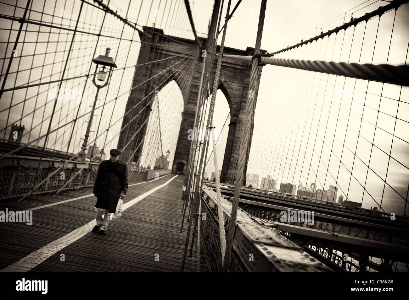 Man on Brooklyn Bridge Walkway Stock Photo - Alamy