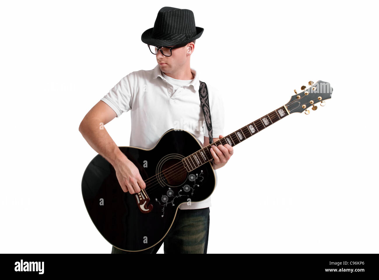 Musician in fedora playing solo. All kinds of musical instruments in ...